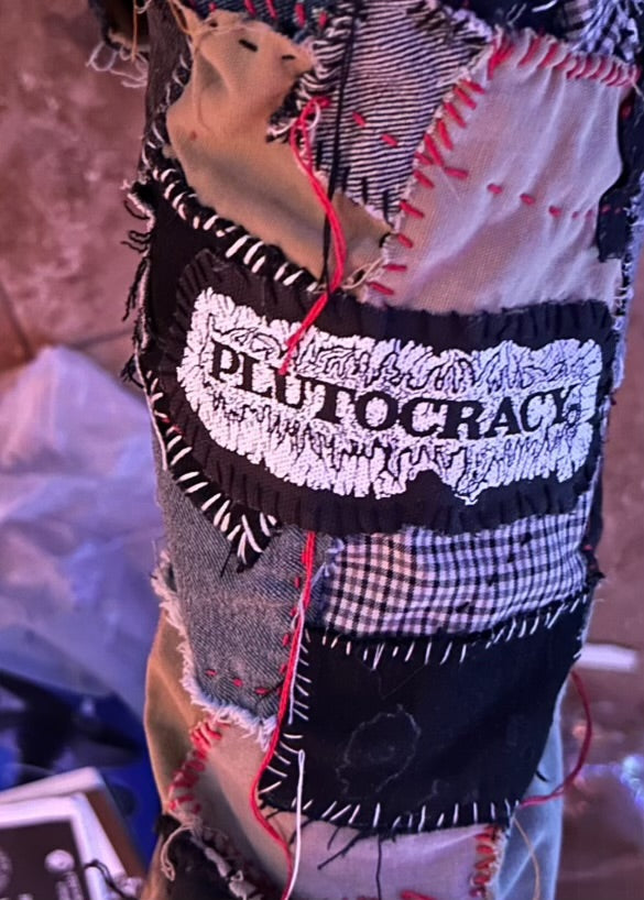 PLUTOCRACY PATCH – PILED FLESH
